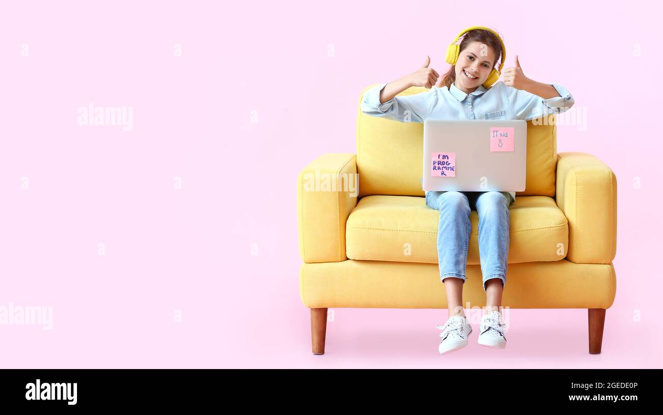 Little programmer with laptop showing thumbs-up on color background ...