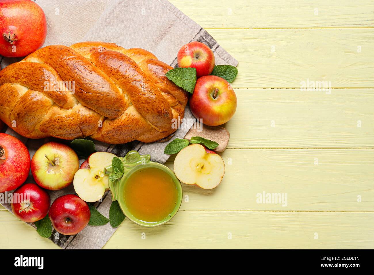 Honey with fruits and challah on color wooden background. Rosh hashanah ...