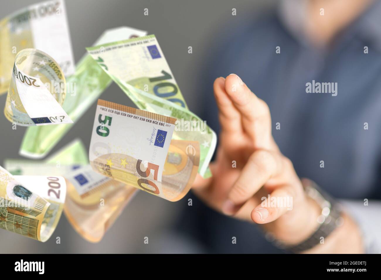 Illustration of floating bank notes and a hand trying to catch them ...