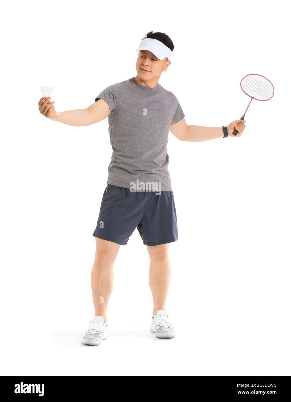 Sporty male badminton player on white background Stock Photo - Alamy
