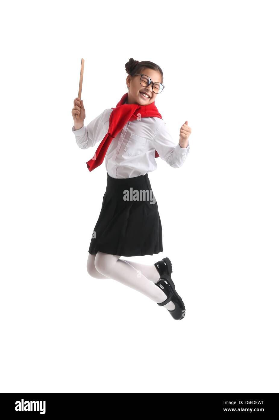 Jumping little schoolgirl with ruler on white background Stock Photo ...