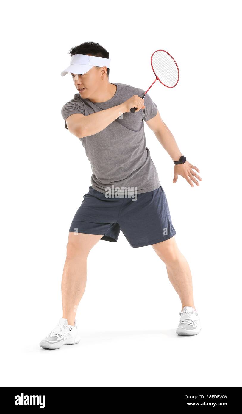 Sporty male badminton player on white background Stock Photo - Alamy