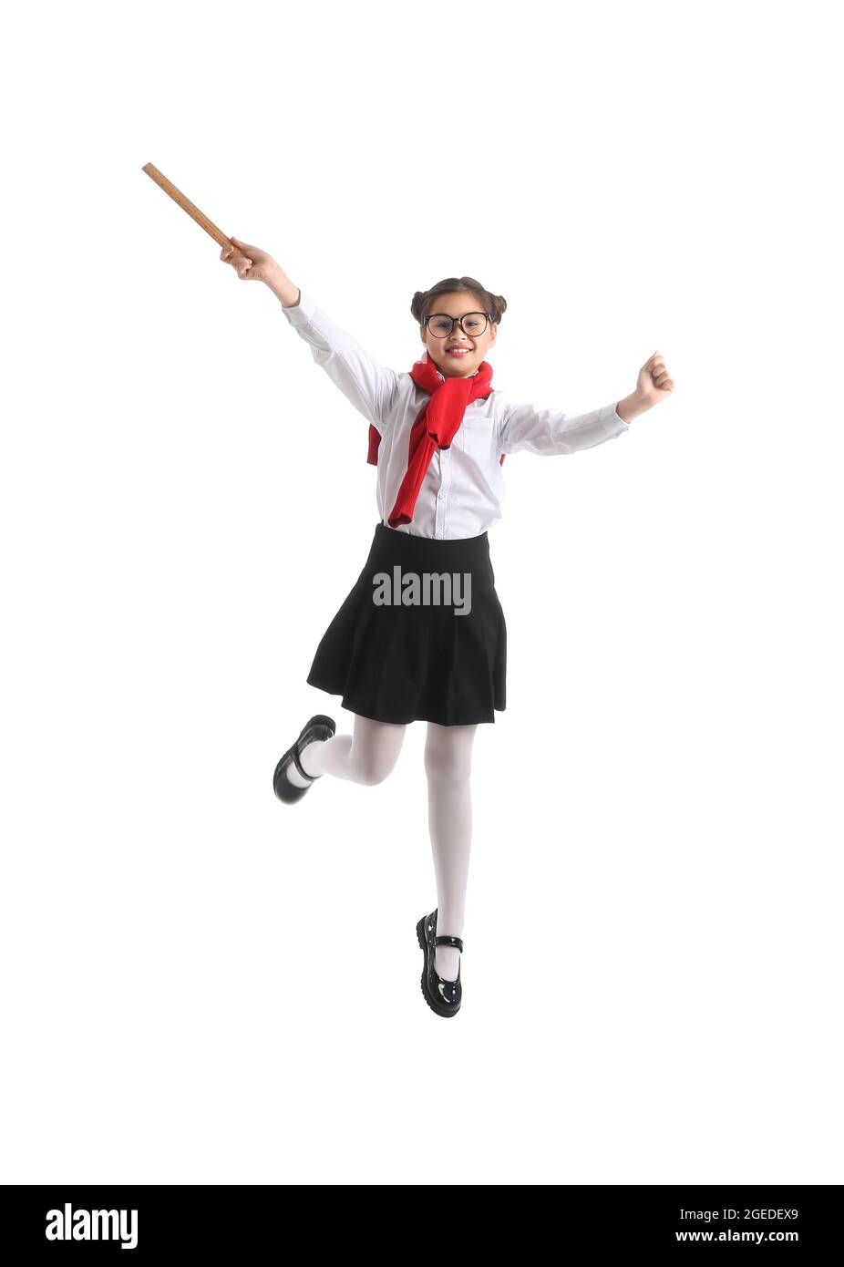 Jumping little schoolgirl with ruler on white background Stock Photo ...