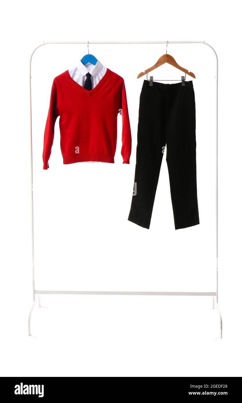 Rack with stylish school uniform on white background Stock Photo - Alamy
