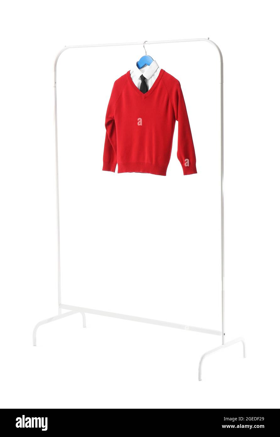 Rack with stylish school uniform on white background Stock Photo - Alamy