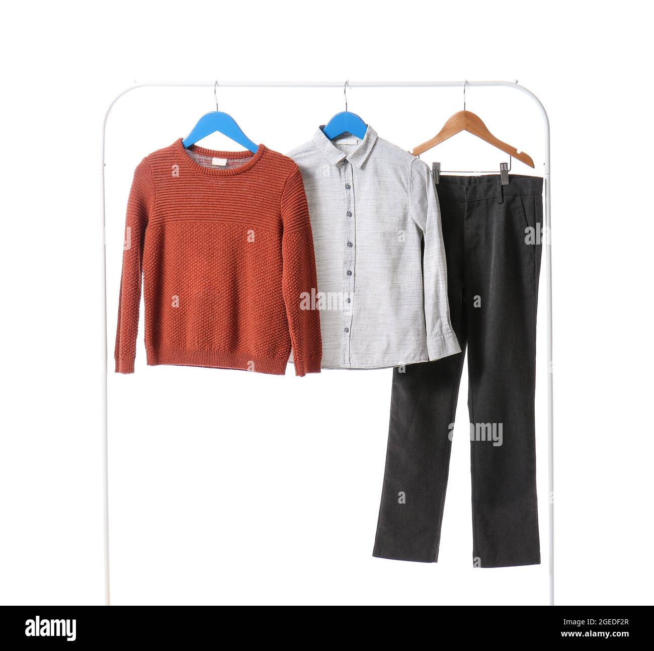 Rack with stylish school uniform on white background Stock Photo - Alamy