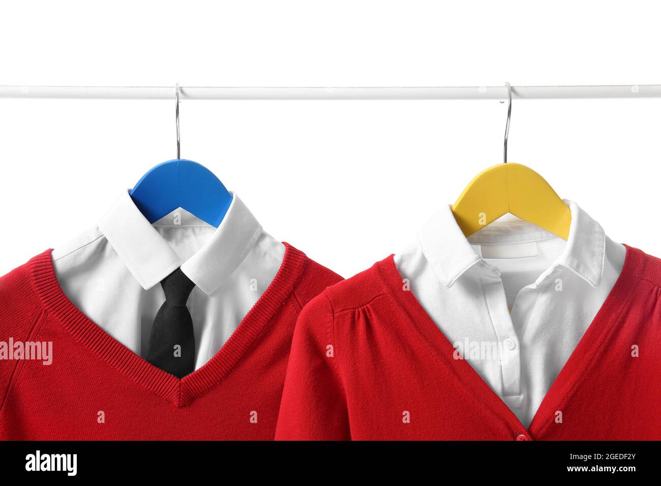 Rack with stylish school uniform on white background Stock Photo - Alamy