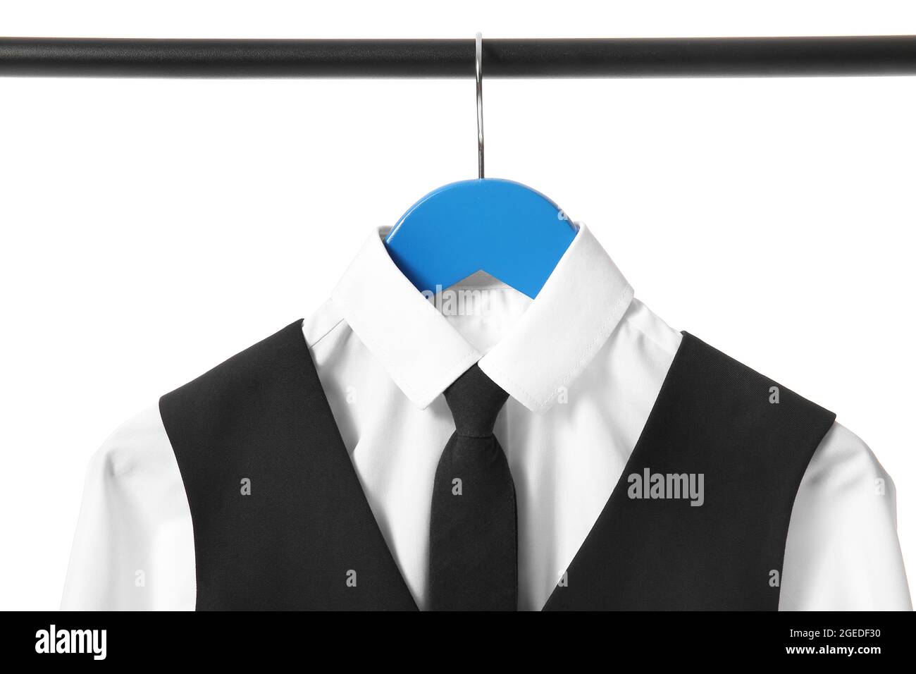 Hanger with stylish school uniform on white background Stock Photo - Alamy