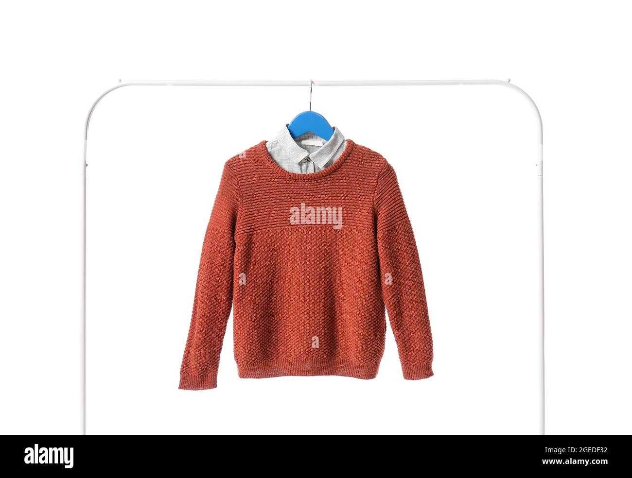 Rack with stylish school uniform on white background Stock Photo - Alamy