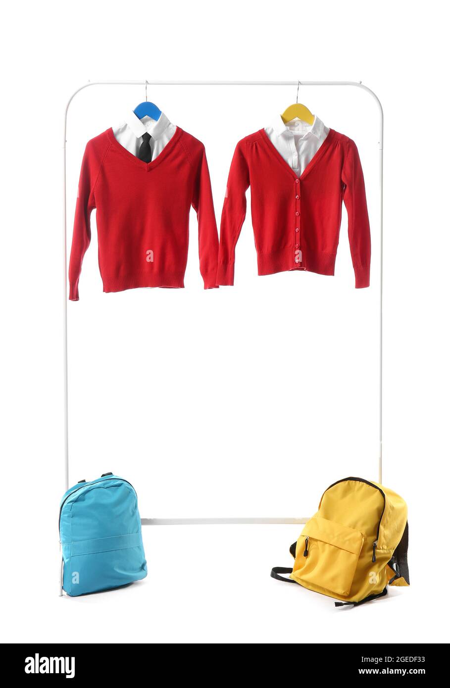 Rack with stylish school uniform on white background Stock Photo - Alamy