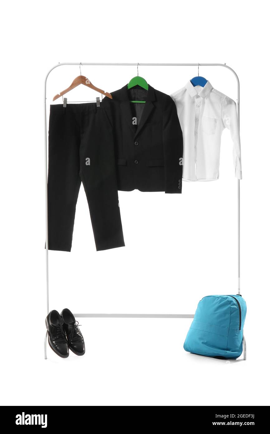 Rack with stylish school uniform on white background Stock Photo - Alamy