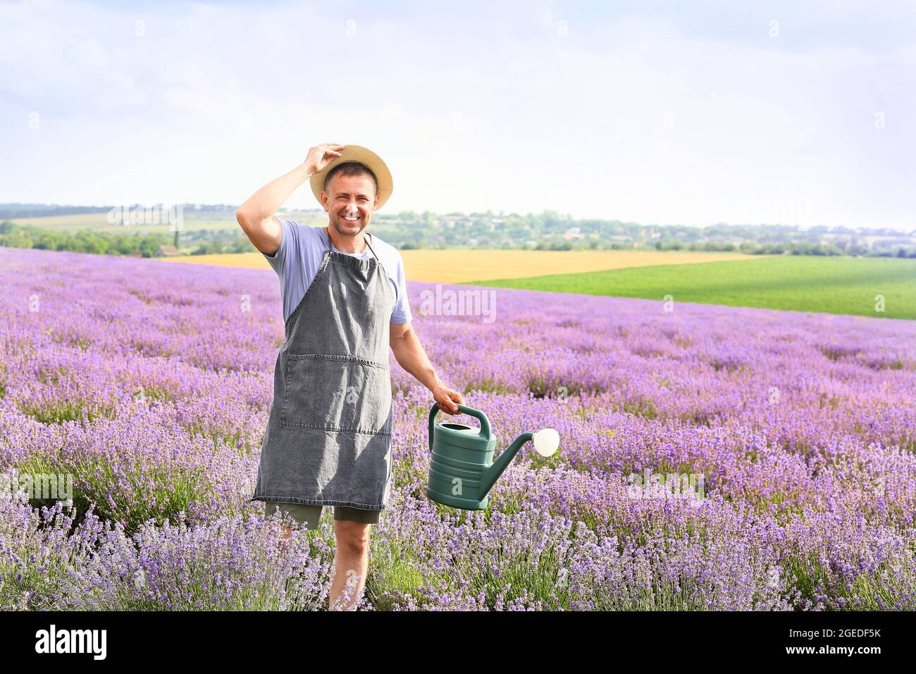 Farmer watering can in hi-res stock photography and images - Alamy