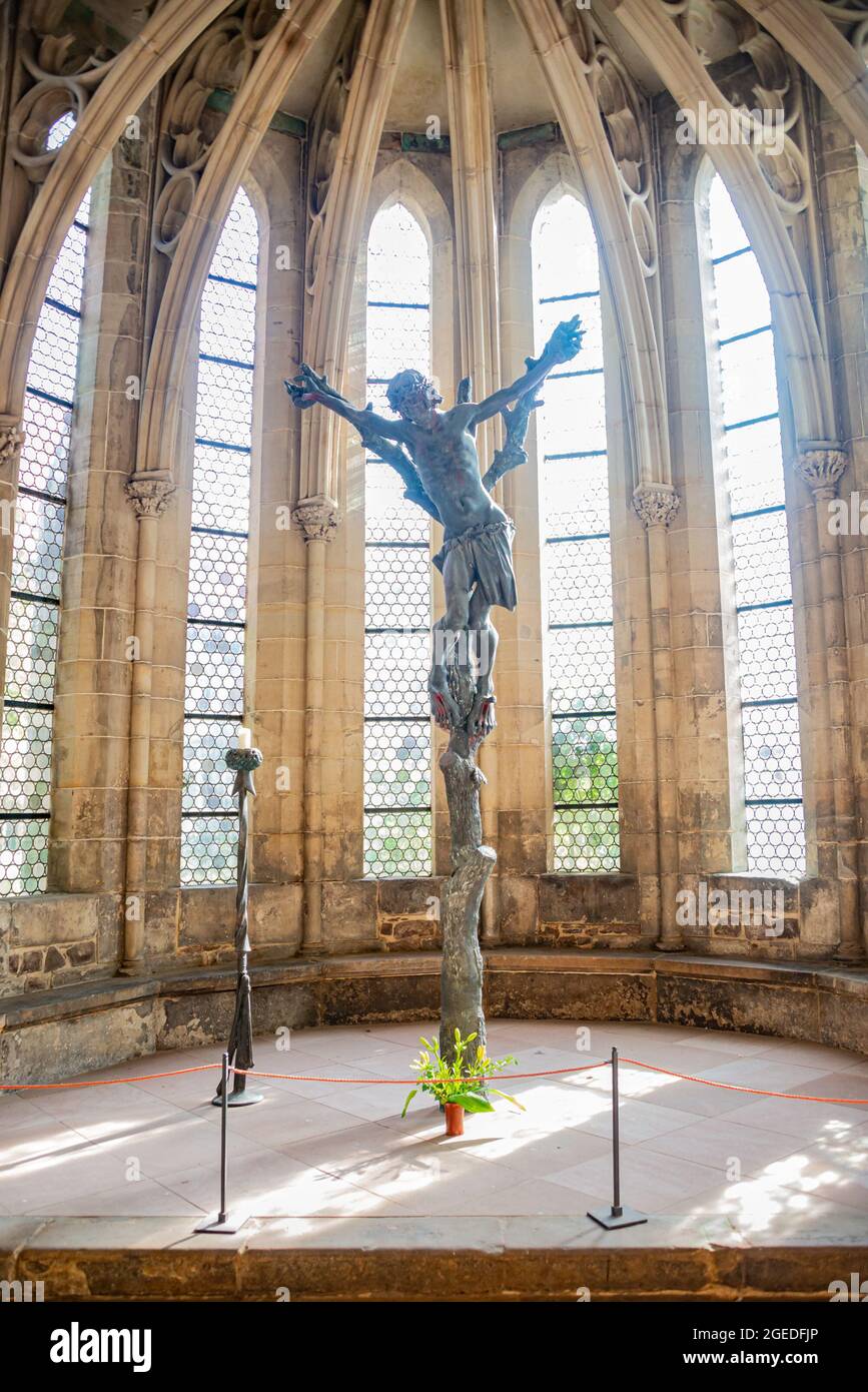 Interior statue of an ancient cross with crucified Christ in Magdeburg ...