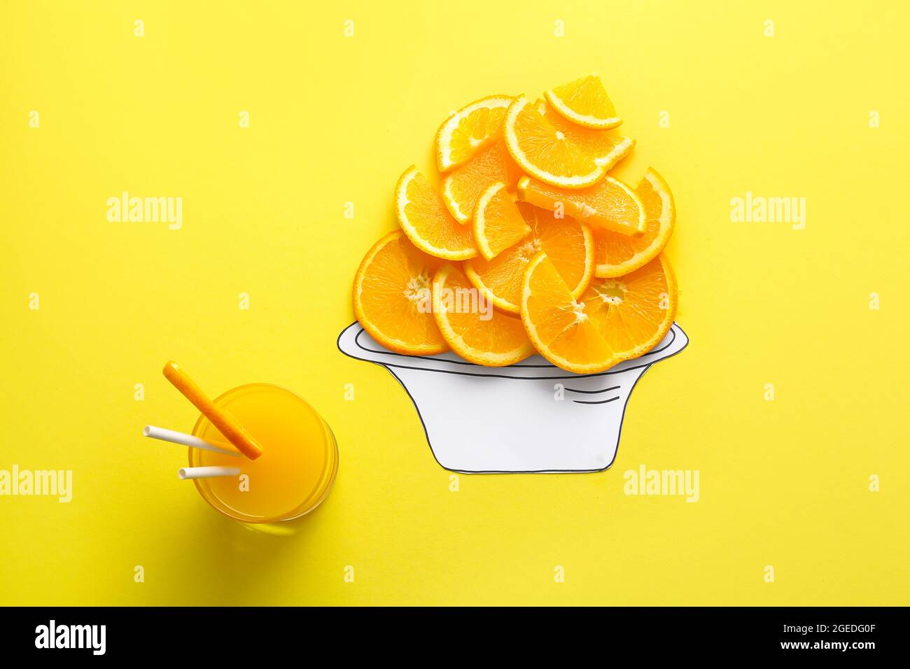 Creative composition with drawn bowl, orange slices and glass of juice ...