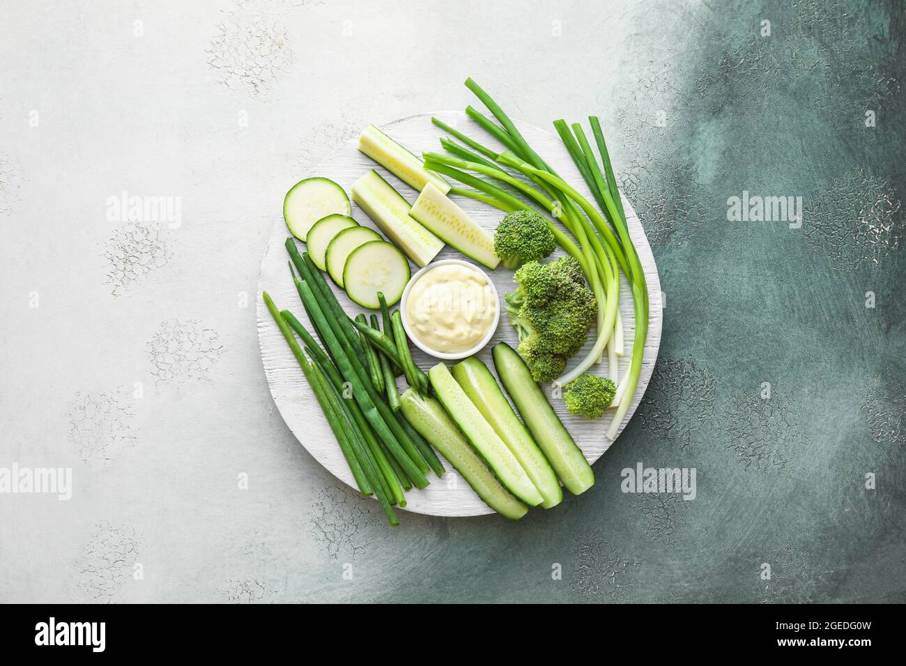 Board with different green vegetables on grunge background Stock Photo ...