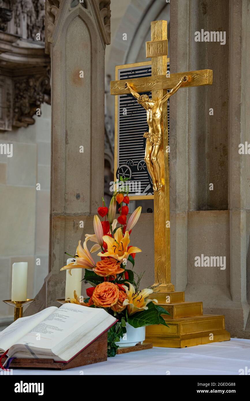 Interior statue of an ancient golden cross with crucified Christ ...