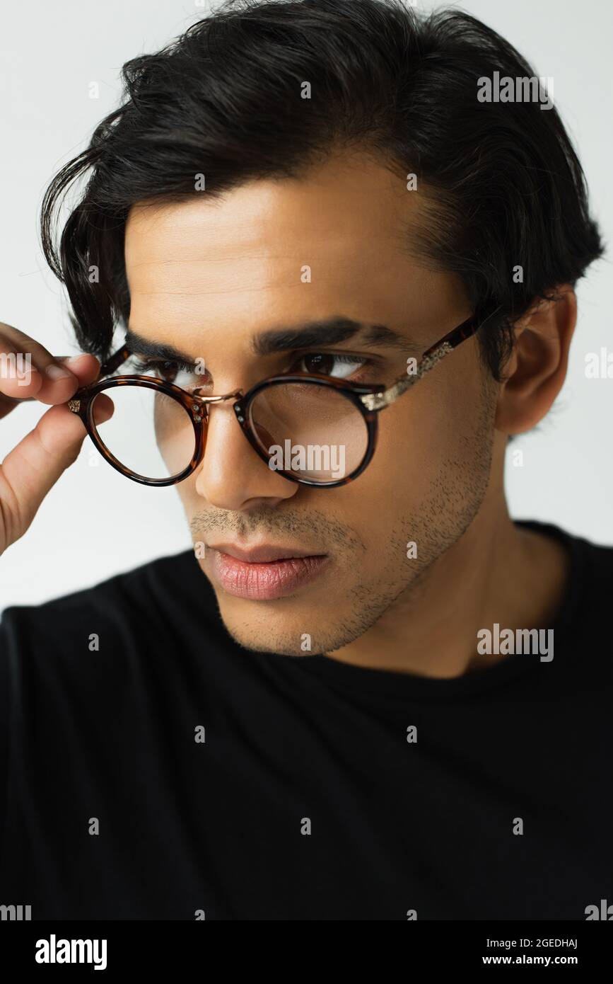Stylish man adjusting eyeglasses hi-res stock photography and images ...