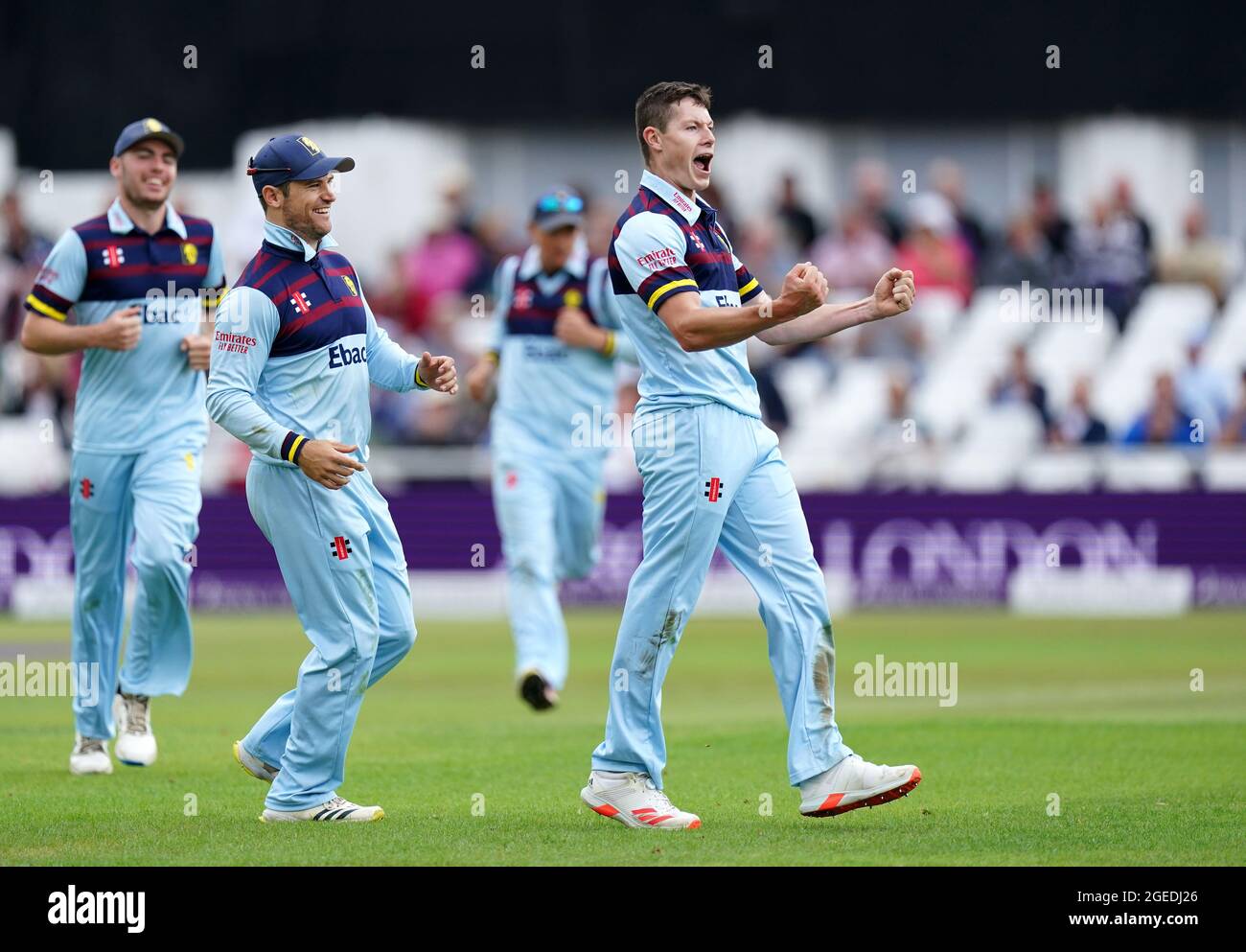 Durham's Matty Potts (right) celebrates taking the wicket of Glamorgan ...