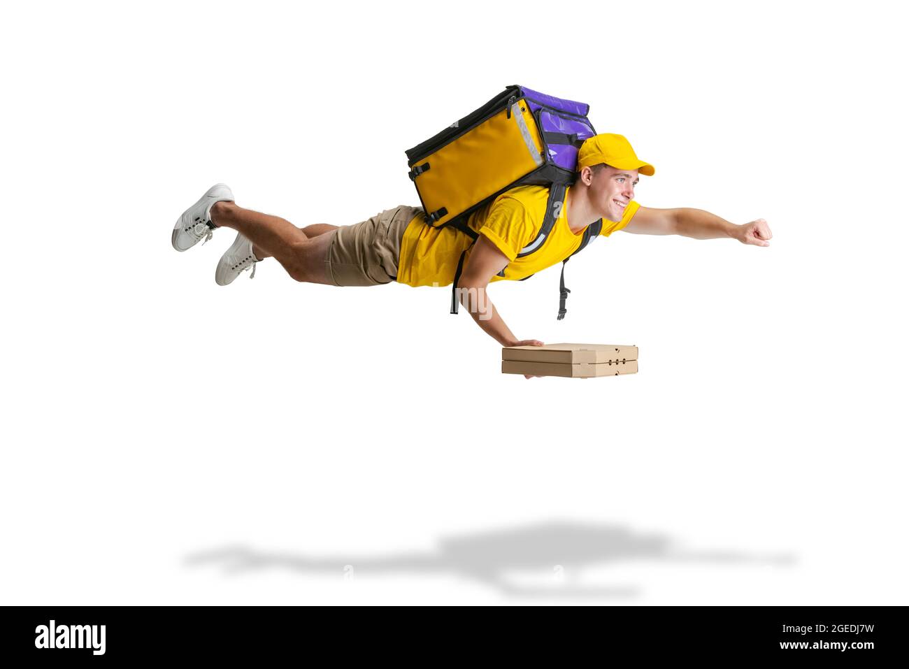 Young delivery man in yellow uniform flying to deliver order isolated ...
