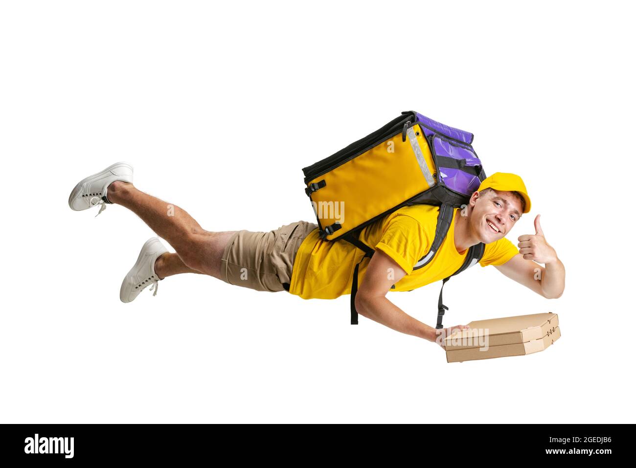 Young delivery man in yellow uniform flying to deliver order isolated ...