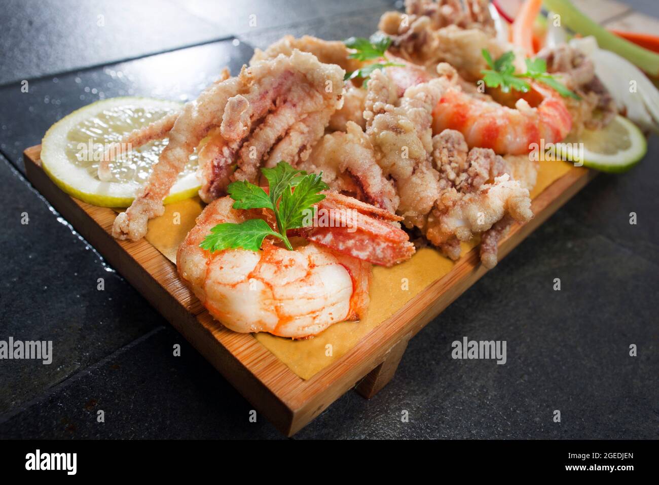 Presentation of a second dish based on fried fish with vegetables Stock ...