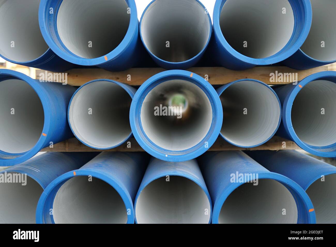 Closeup shot of a stack of blue casing pipes Stock Photo - Alamy