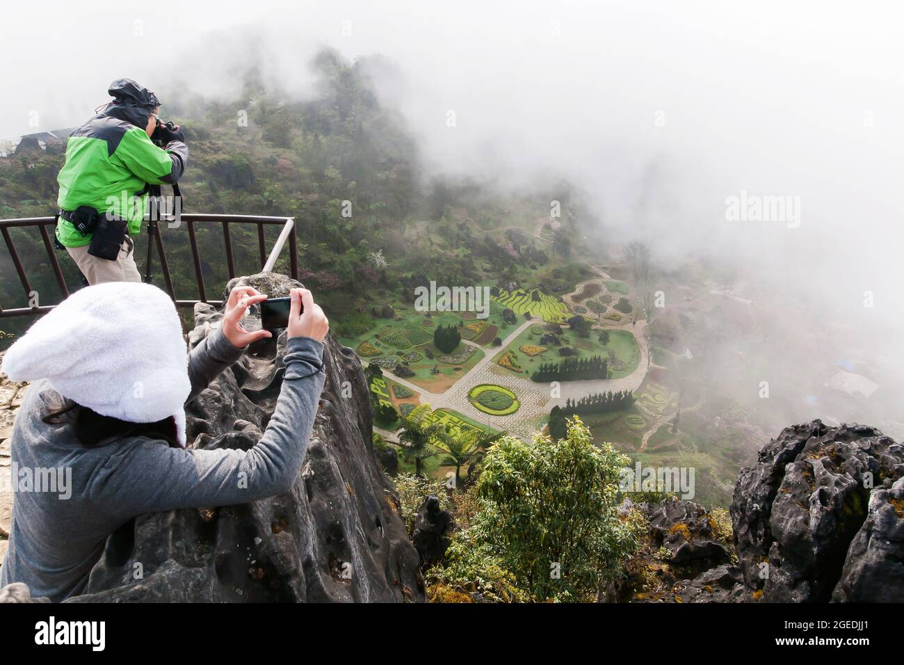 Tourists enjoy taking pictures at the viewpoint of Sa Pa, top tourist ...