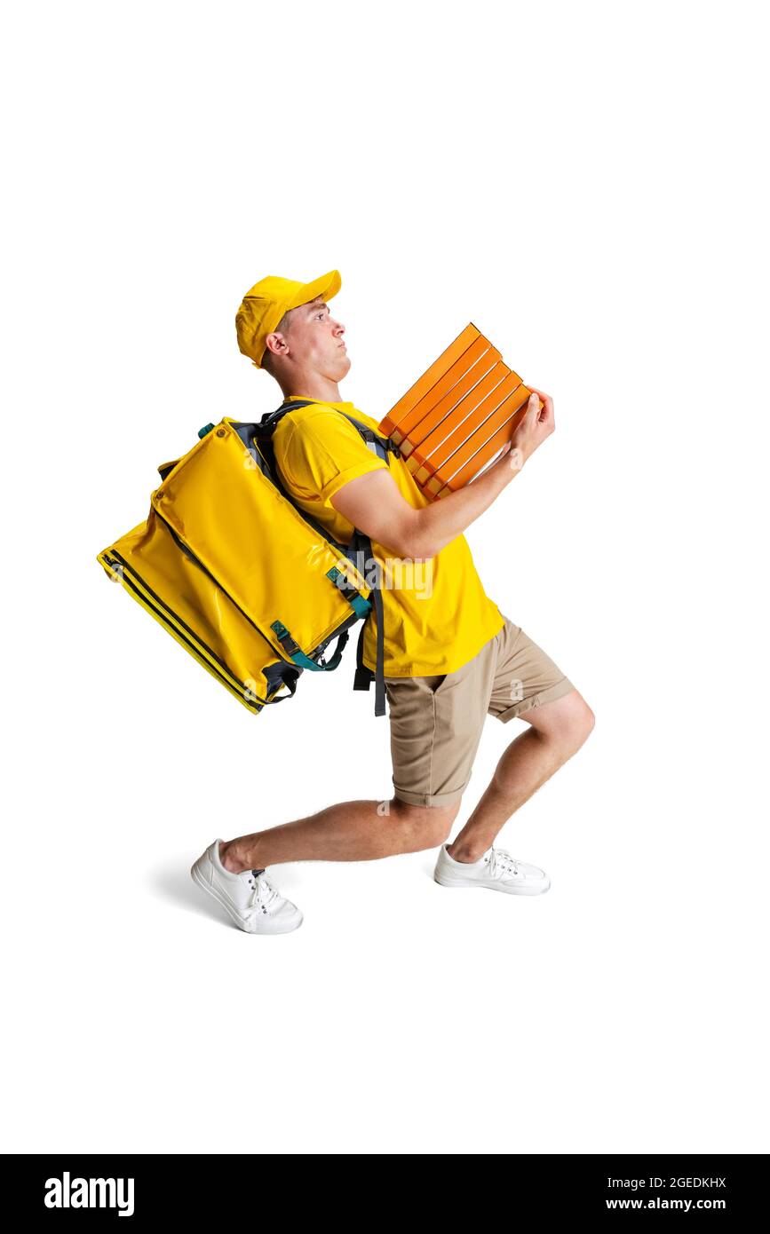Portrait of delivery man in yellow uniform deliver order of pizza to ...