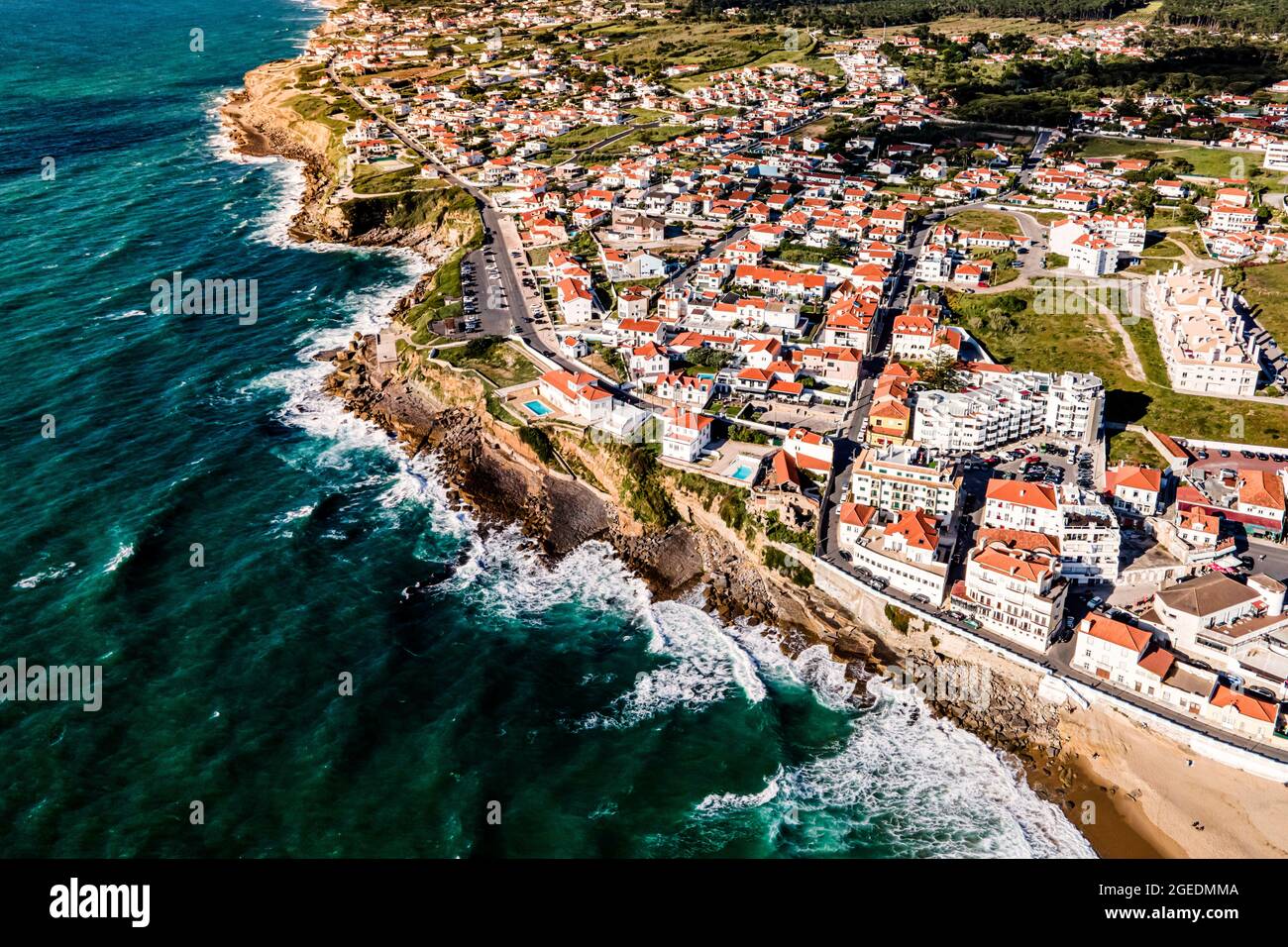 Aerial view of Praia das Macas little township by Portuguese coastline ...