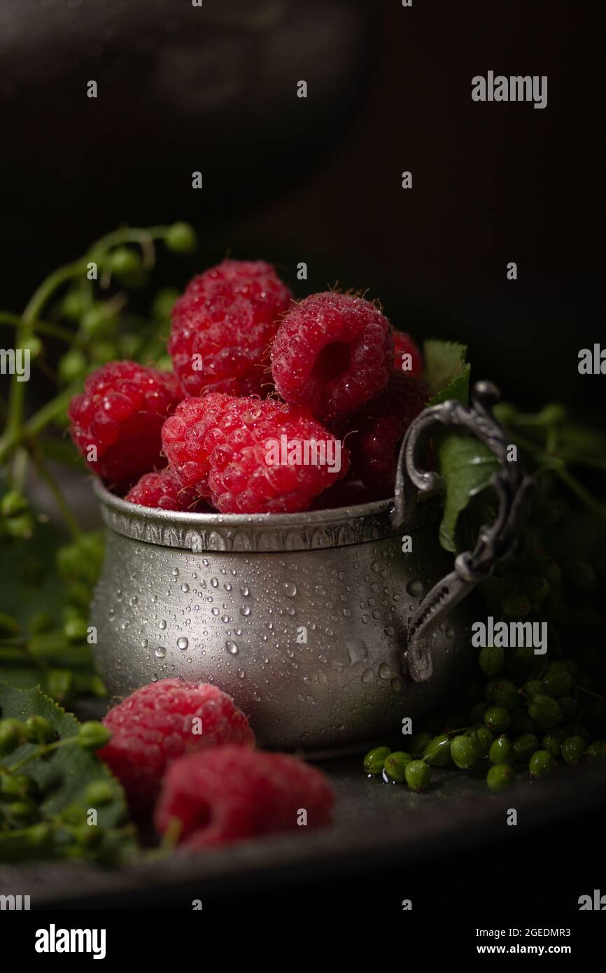 Vintage still life with raspberries and elderberries Stock Photo - Alamy