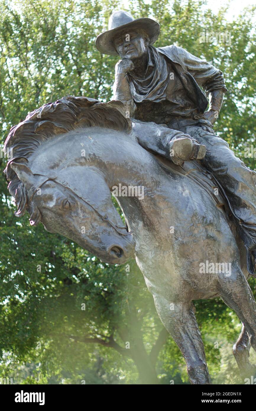 DALLAS, UNITED STATES - Aug 23, 2018: A bronze Statue of Cowboy at the ...
