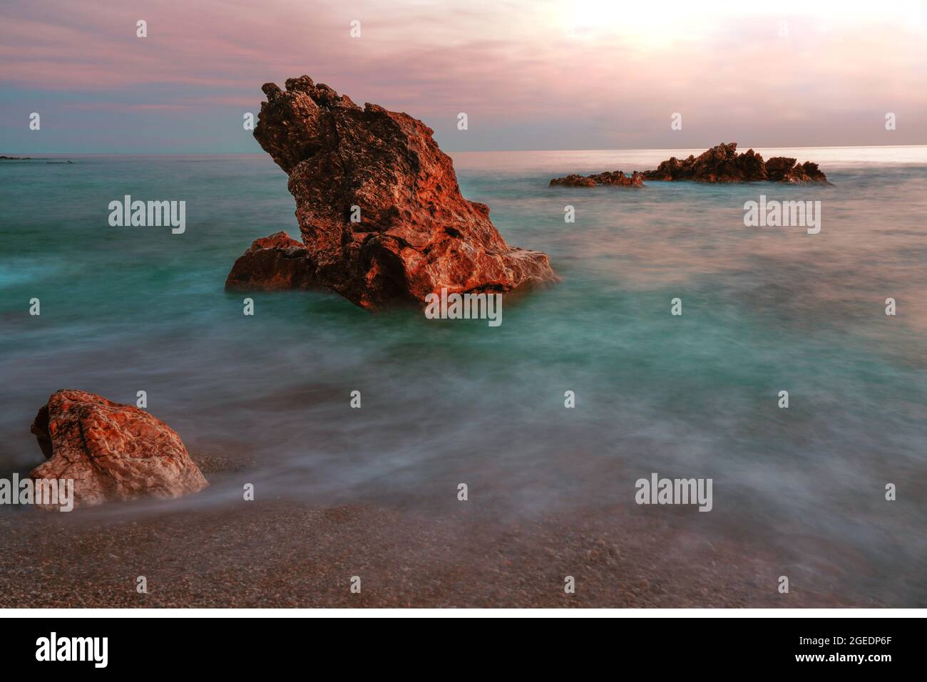 Long Exposure Sunset Photo with Motion Blur and Rocks Stock Photo - Alamy