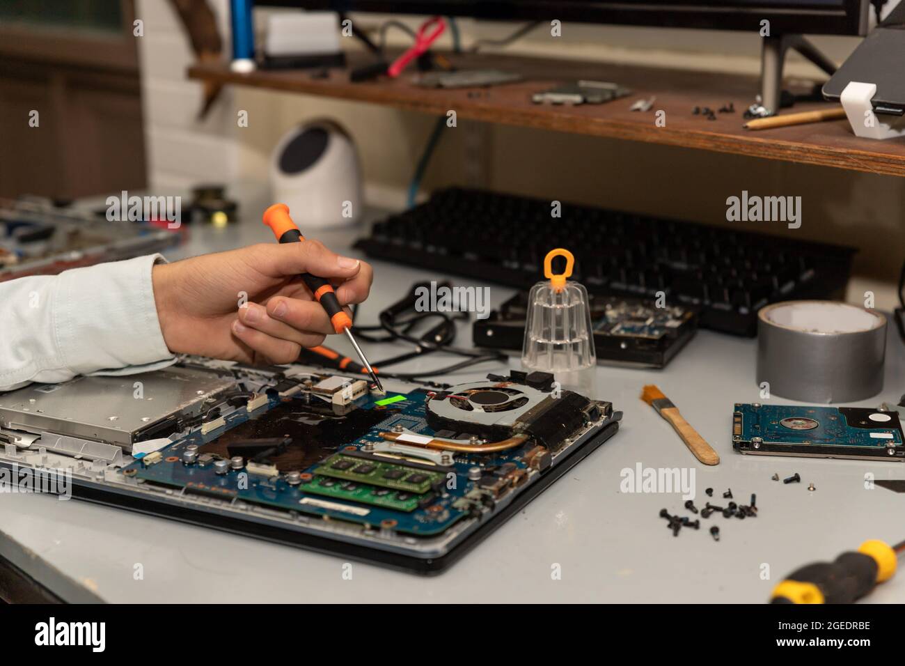 Computer repair technician repairing a laptop Stock Photo - Alamy