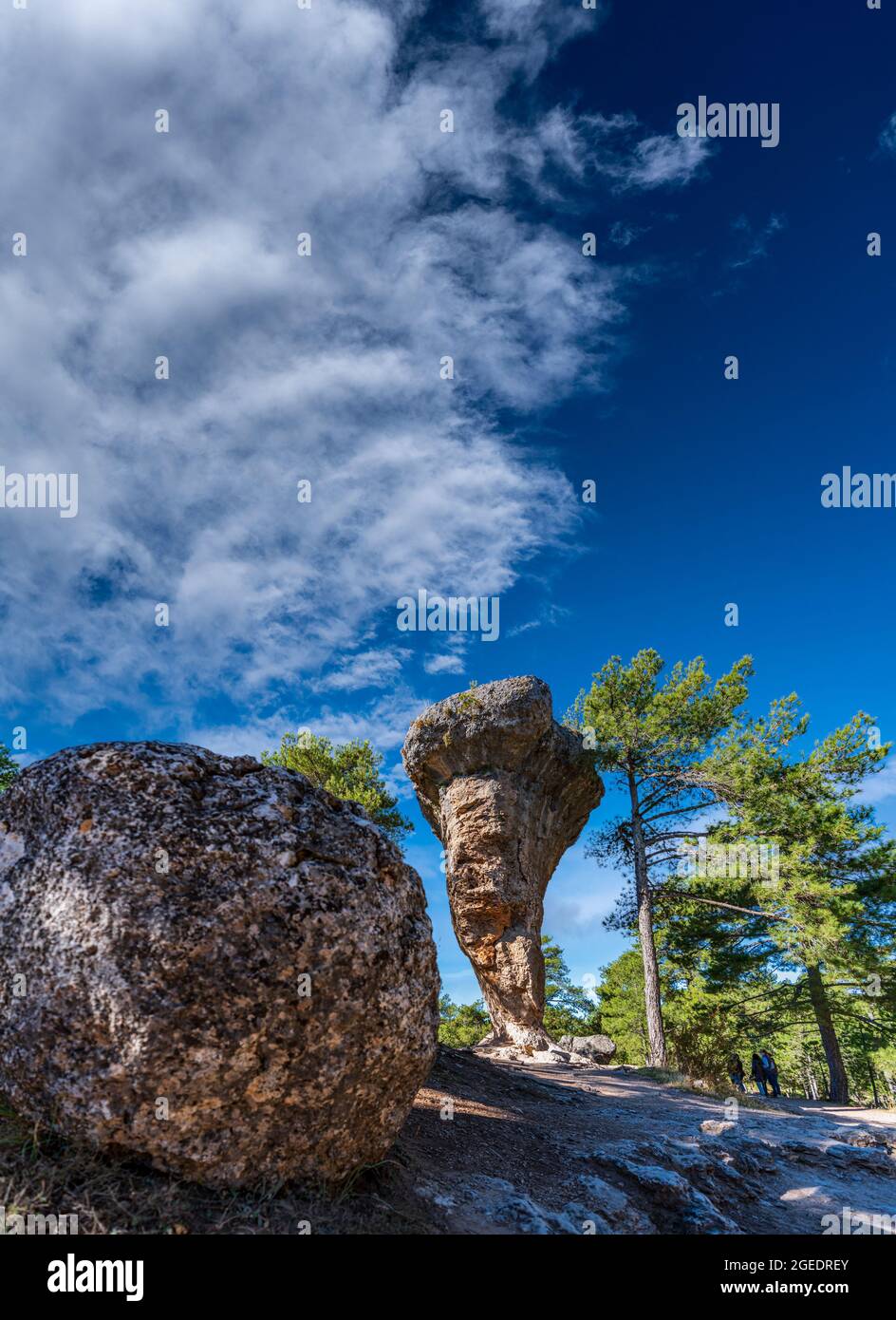 Huge boulder in balance with blurred unrecognizable tourists Stock ...