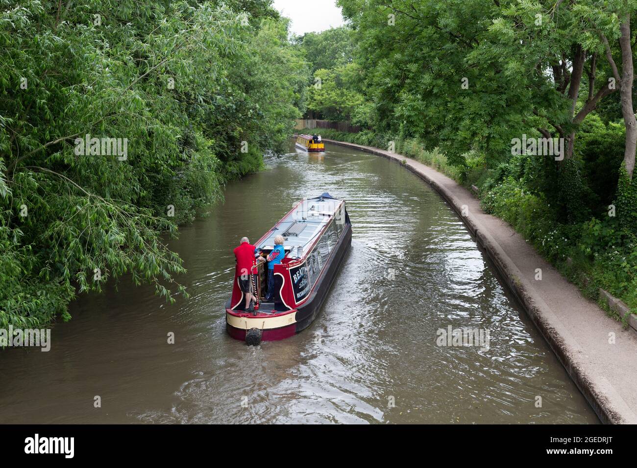 People enjoy a relaxing canal boat ride along the Grand Union Canal ...