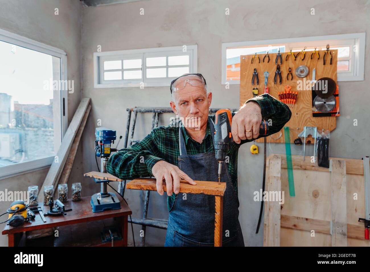 Senior Caucasian carpenter working in his room Stock Photo - Alamy