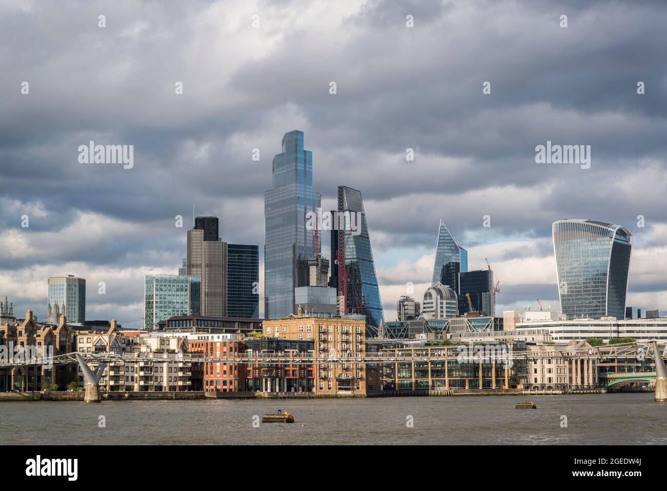 View of the City of London past the Millennium bridge, London, England ...