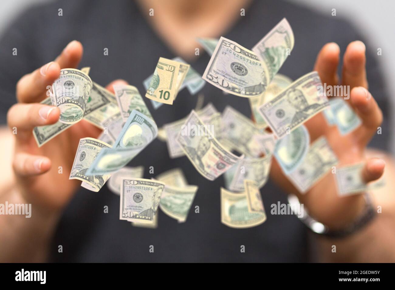 Businessman's hands holding th floating dollar banknotes-business and ...