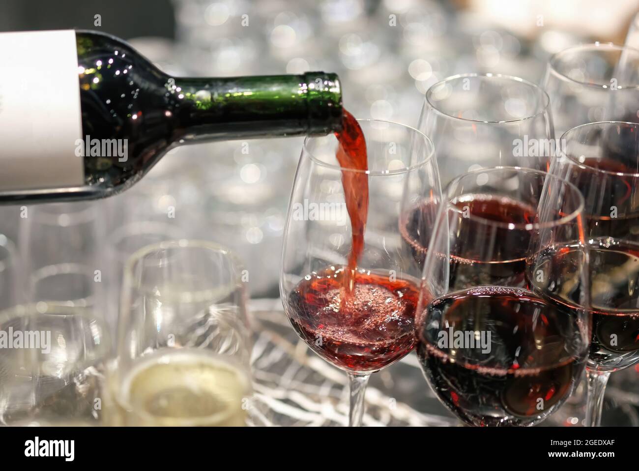 Pouring wine many glasses hi-res stock photography and images - Alamy