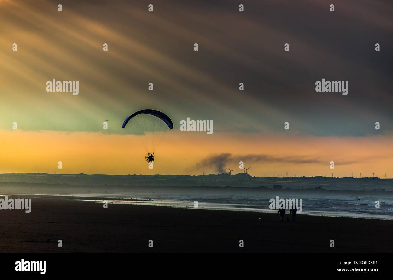 Powered paraglider over Coatham Beach, Redcar, North Yorkshire, England ...