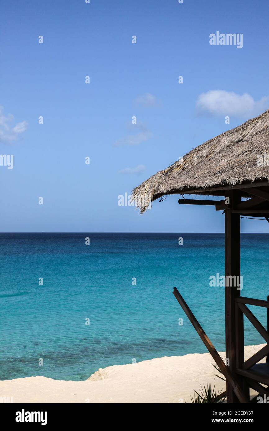 Roof detail with blue sky and ocean on tropical island Stock Photo - Alamy