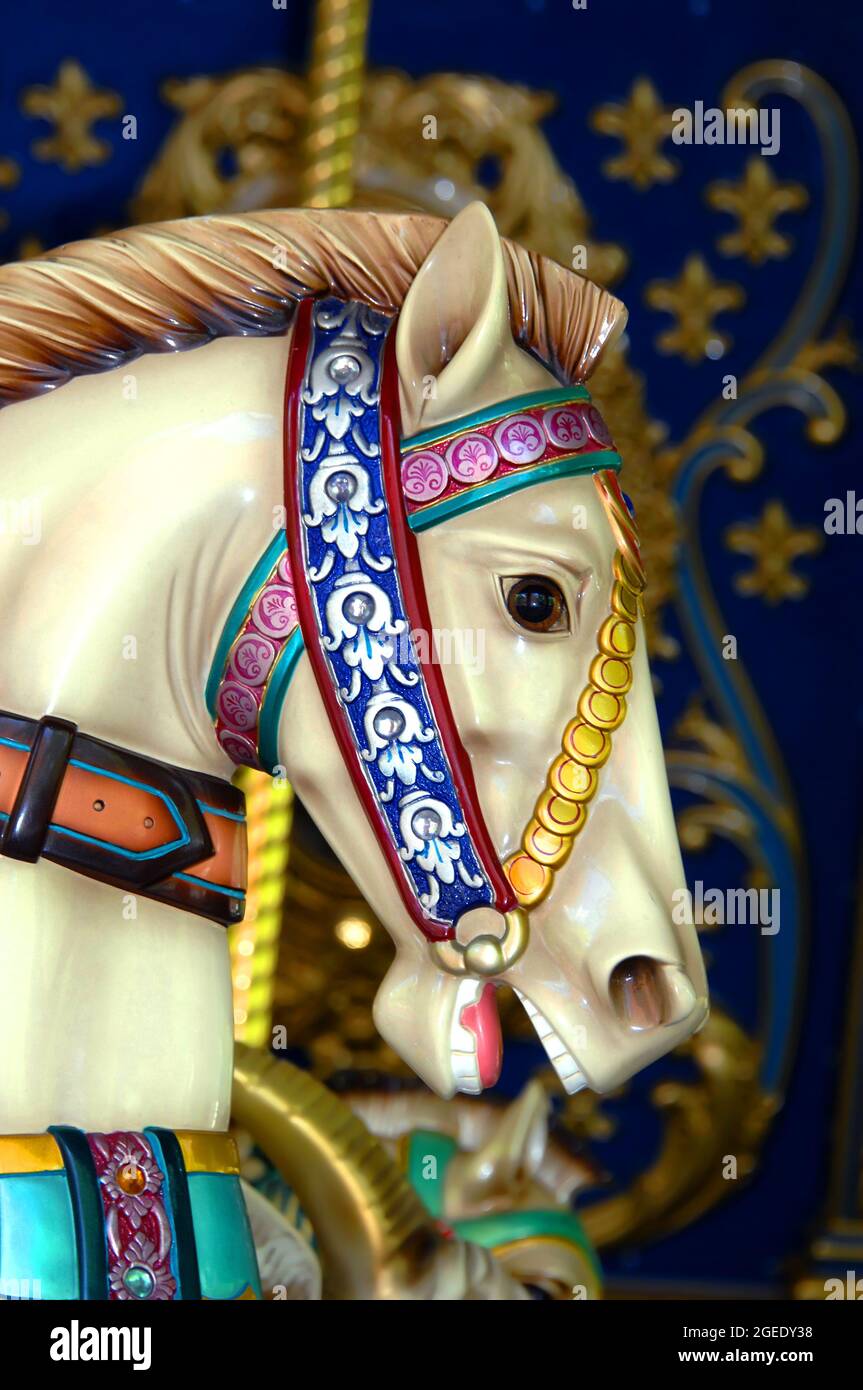 Beautiful head of a carousel horse is painted with brilliant colors ...