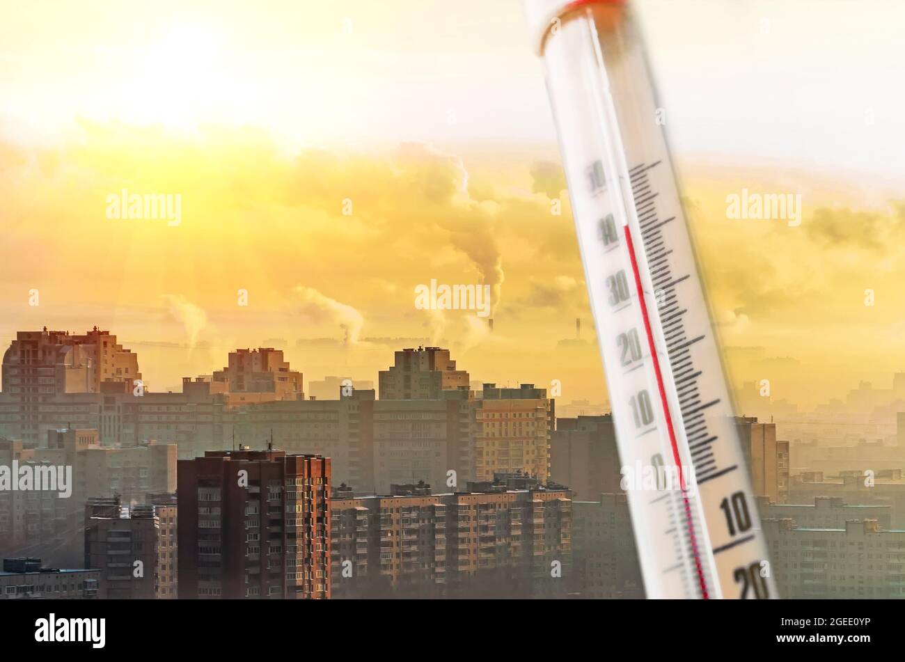 Thermometer against the background of a polluted city smog during hot ...