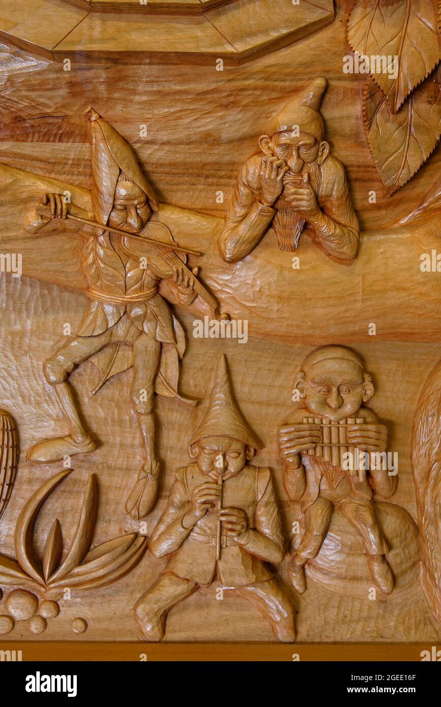 wood carving, gnomes playing musical instruments, close-up; whimsical ...