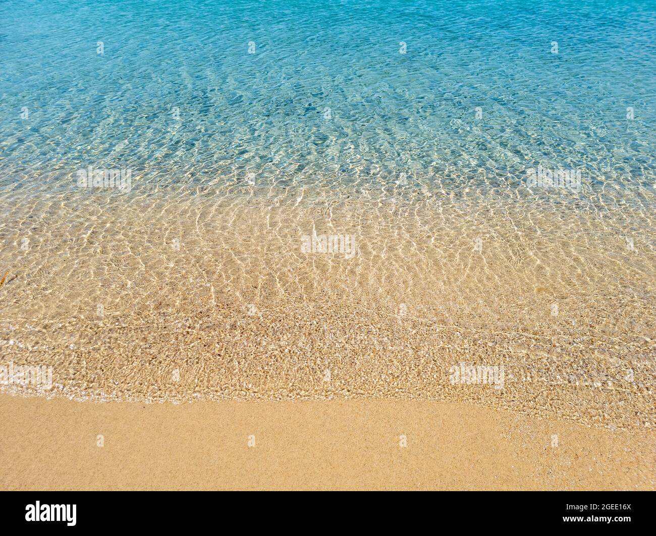Ornos empty tropical sandy beach Mykonos island, Cyclades Greece. Clear ...