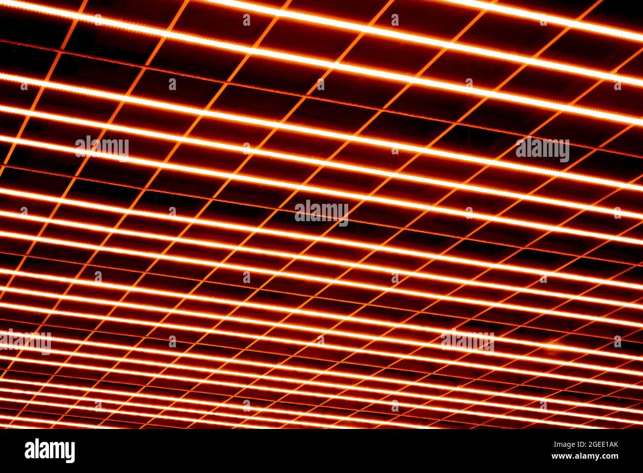 Abstraction of light-emitting diode lines, laser of a red shade of a ...