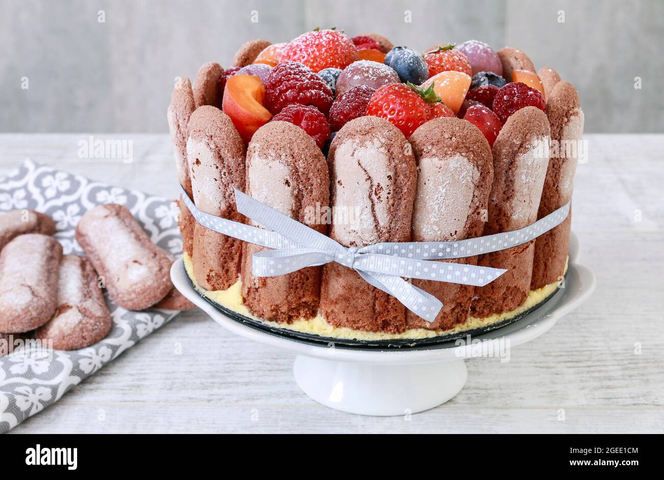 French charlotte cake with summer fruits. Party dessert Stock Photo - Alamy