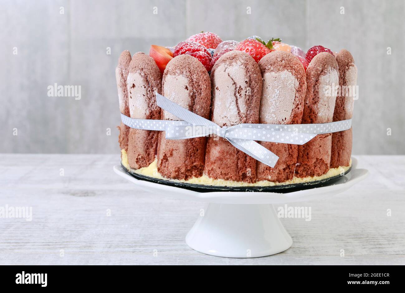 French charlotte cake with summer fruits. Party dessert Stock Photo - Alamy
