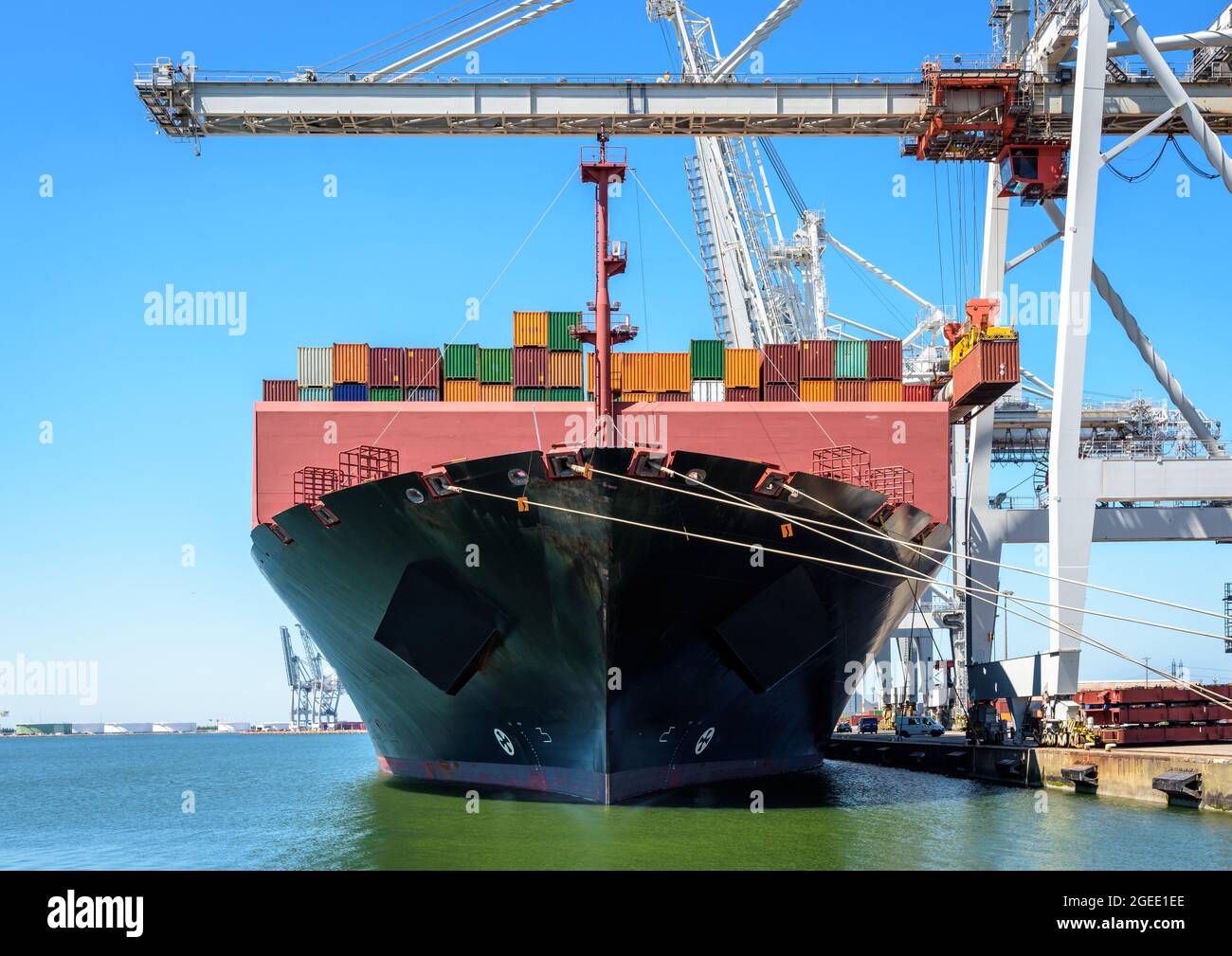 A container ship at the dock loaded by a container gantry crane Stock ...