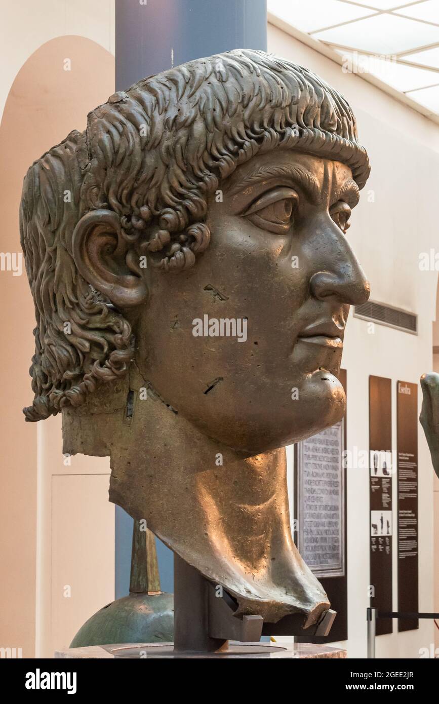 Close-up on giant head of ancient roman emperor sculpted on bronze ...